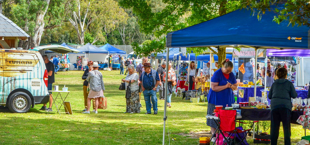 An artisan and handmade craft market in leafy surrounds